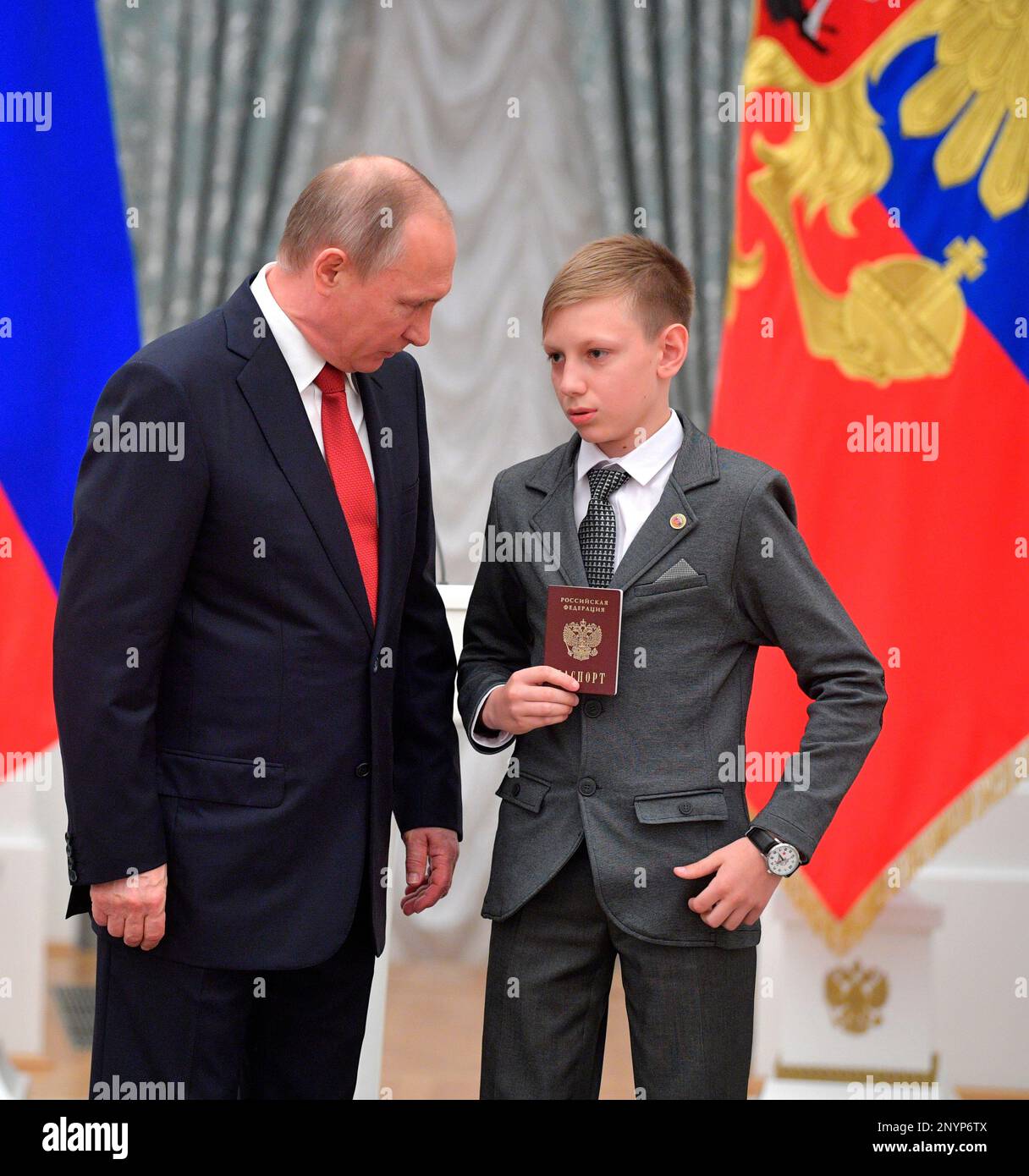 Russian President Vladimir Putin poses for a photo with Vladislav ...
