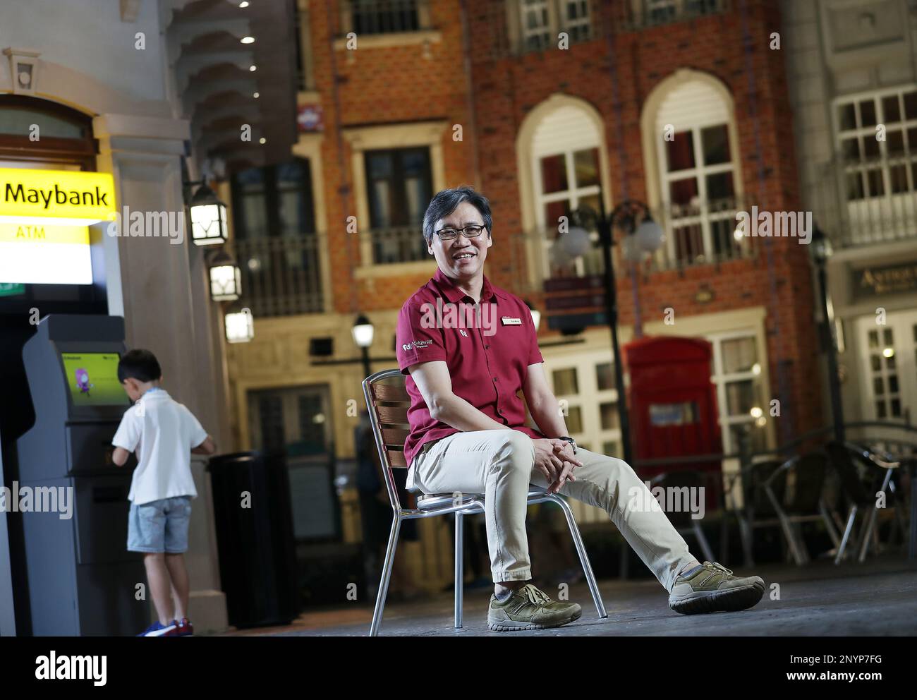 Kidzania General Manager, Leong Yue Weng with children in the kid-sized ...