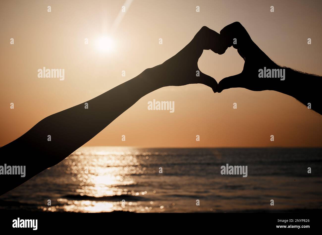 Beach silhouette, sunset and heart hands sign for travel freedom ...