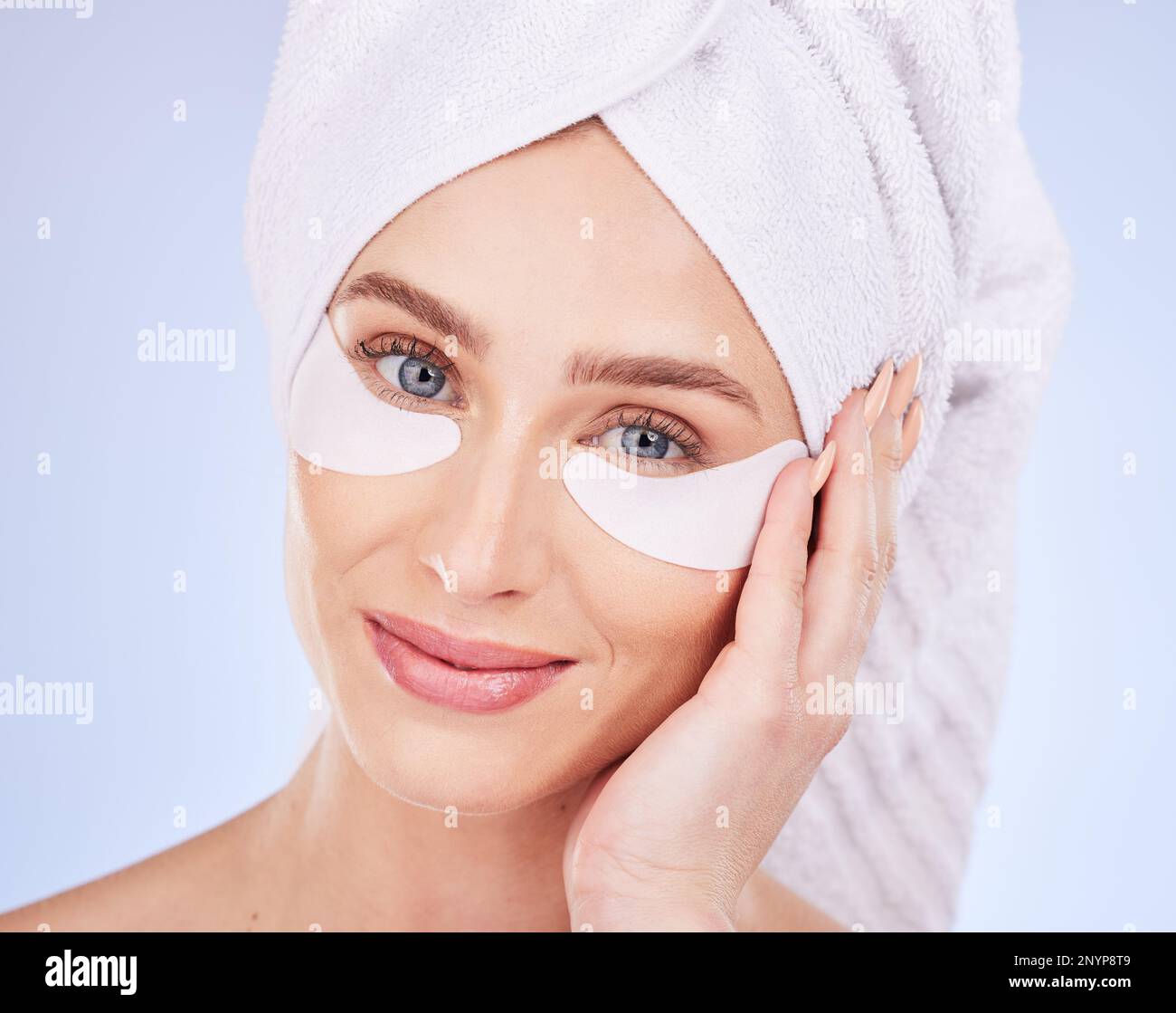 Skincare, face and woman with eye patches in studio isolated on a blue ...