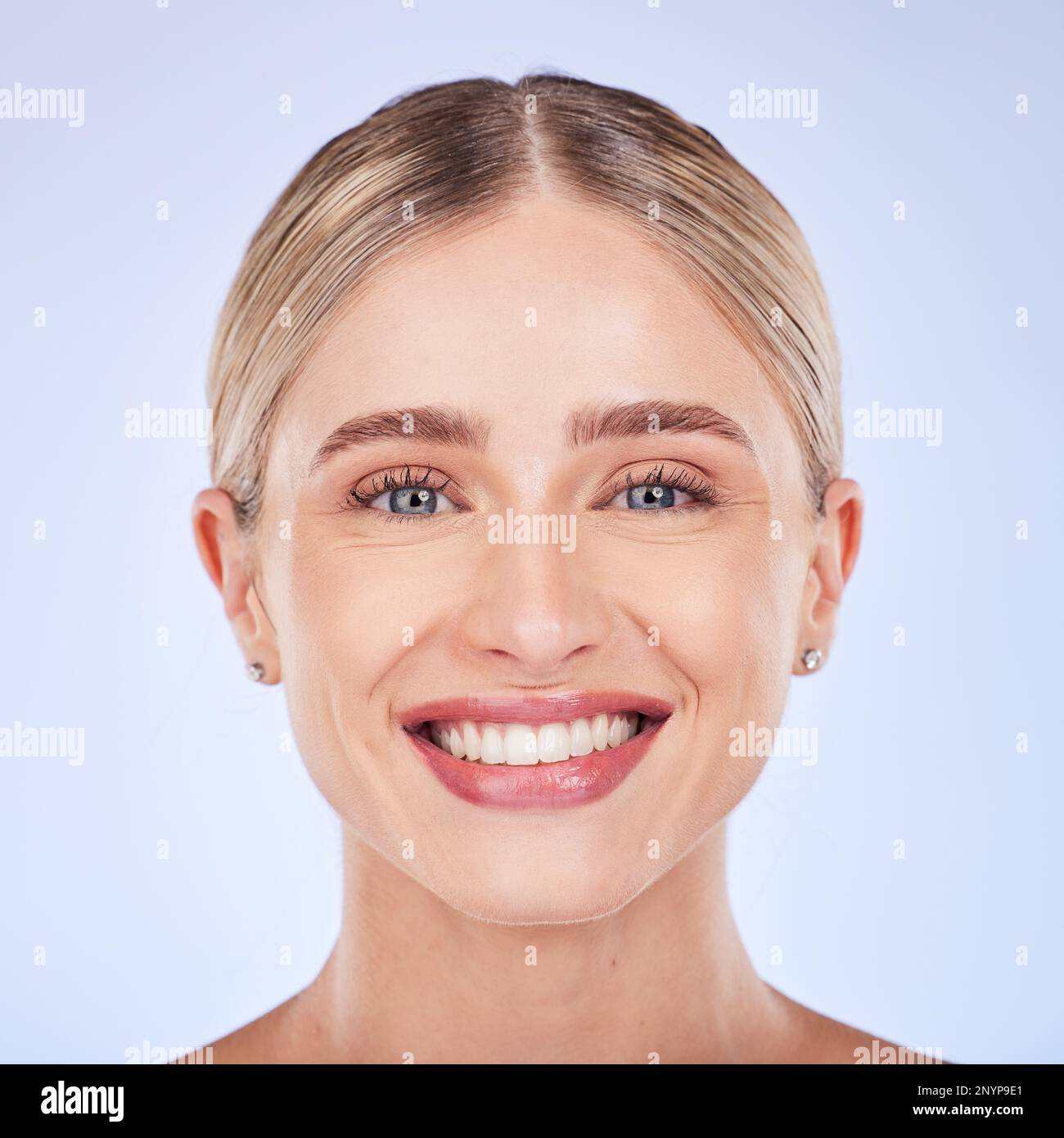 Face portrait, smile and skincare of woman in studio isolated on a blue ...