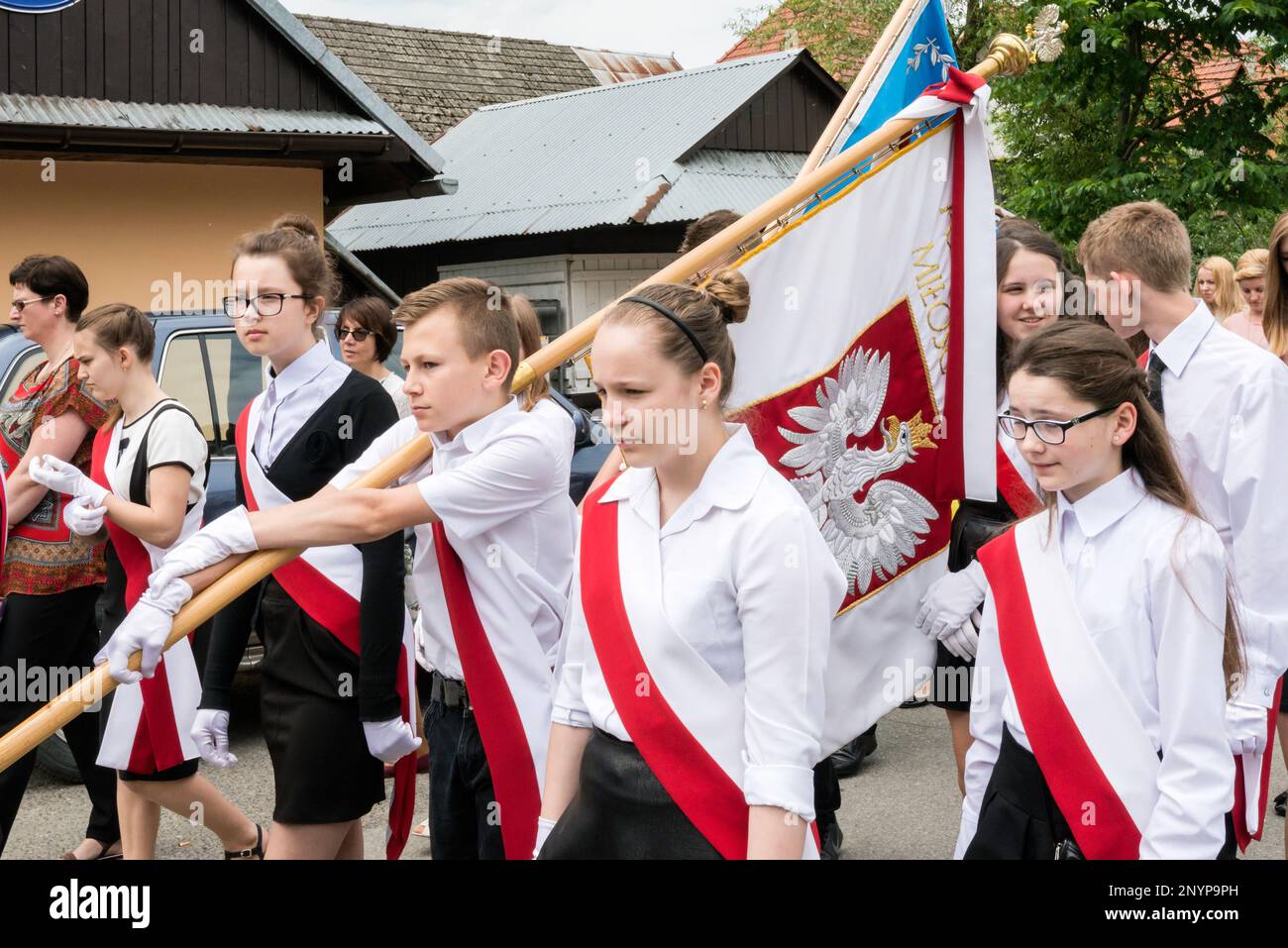 School children carrying a flag with Polish Eagle, Corpus Christi ...