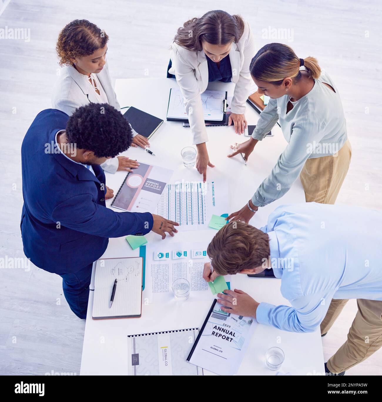 Teamwork, top view and business people in meeting with documents ...