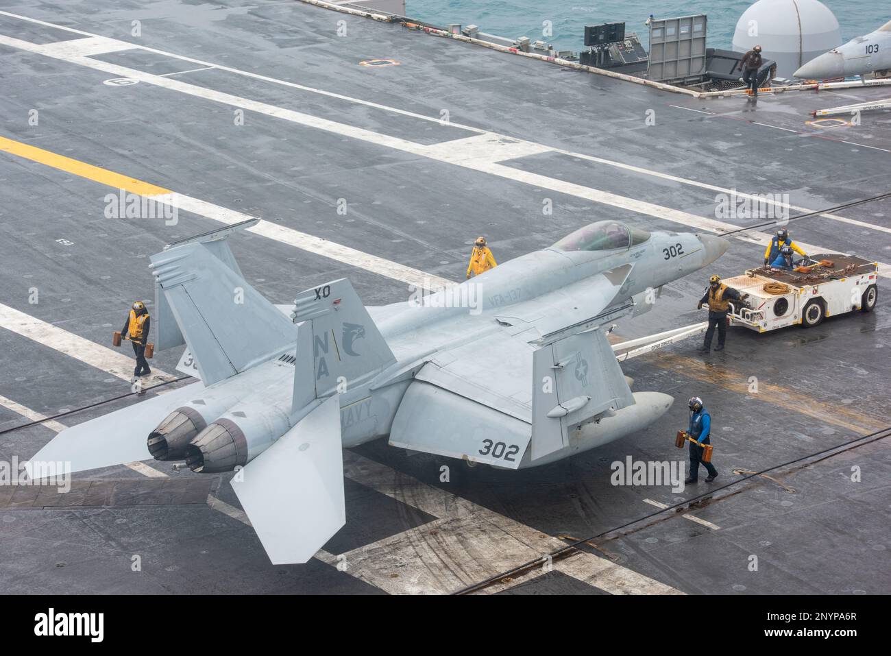 230119-N-NX635-1083 SOUTH CHINA SEA (Jan. 19, 2023) U.S. Navy Sailors tow an F/A-18E Super ...