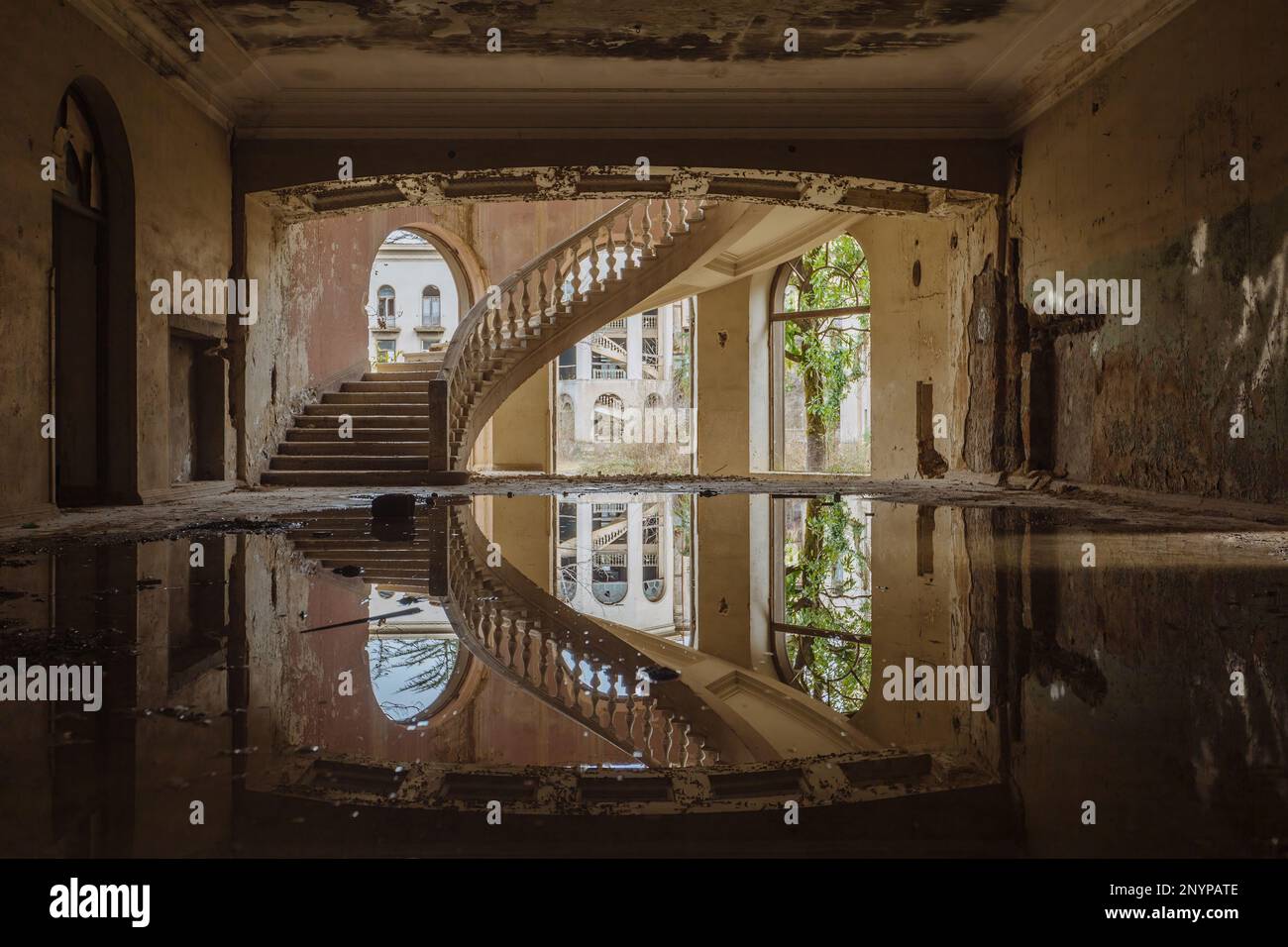 Old flooded abandoned mansion with spiral stair, water reflection Stock ...