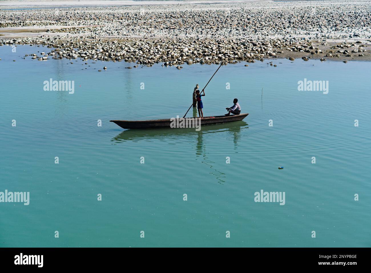 tourists sailing on a wooden boat through river water Stock Photo - Alamy