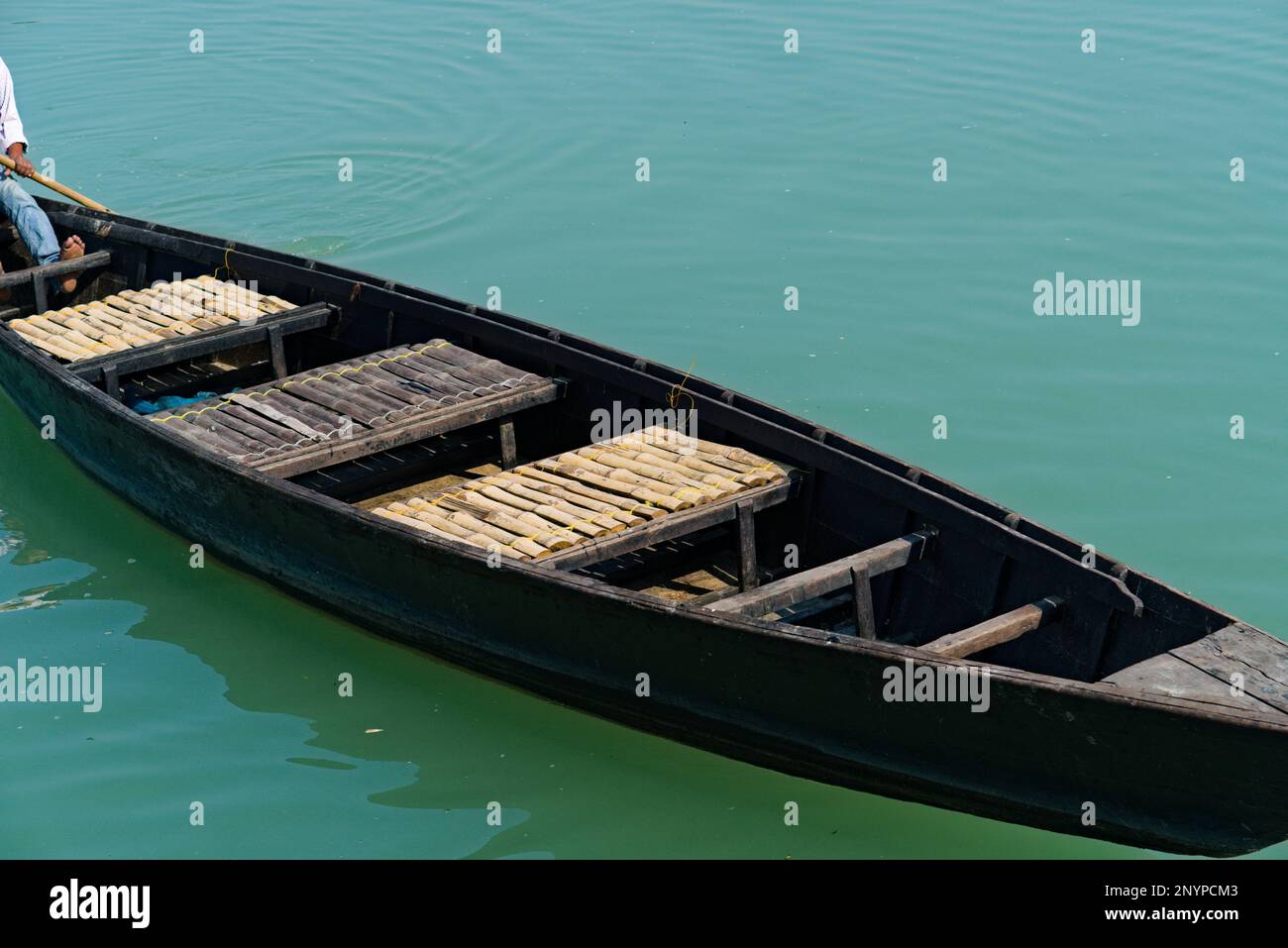 wooden boat floating in the river water Stock Photo - Alamy