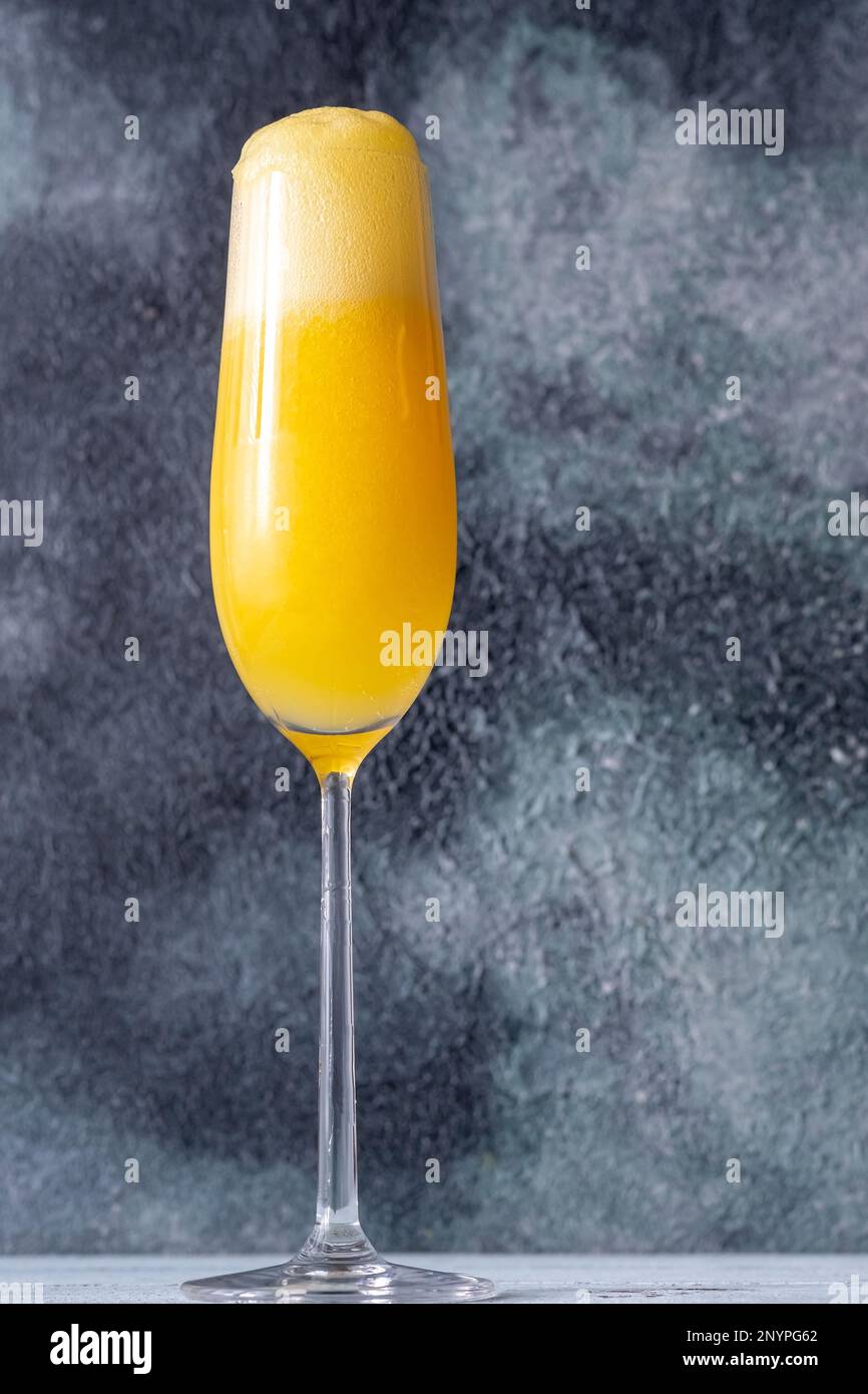 Flute Glass of Mango Mimosa cocktail on gray background Stock Photo - Alamy