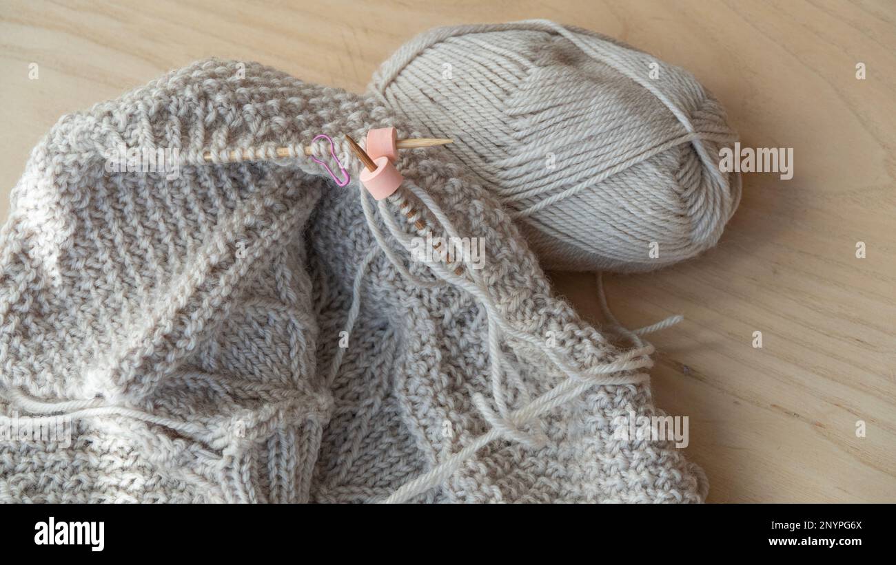 Knitting wool and sticks in close up Stock Photo - Alamy