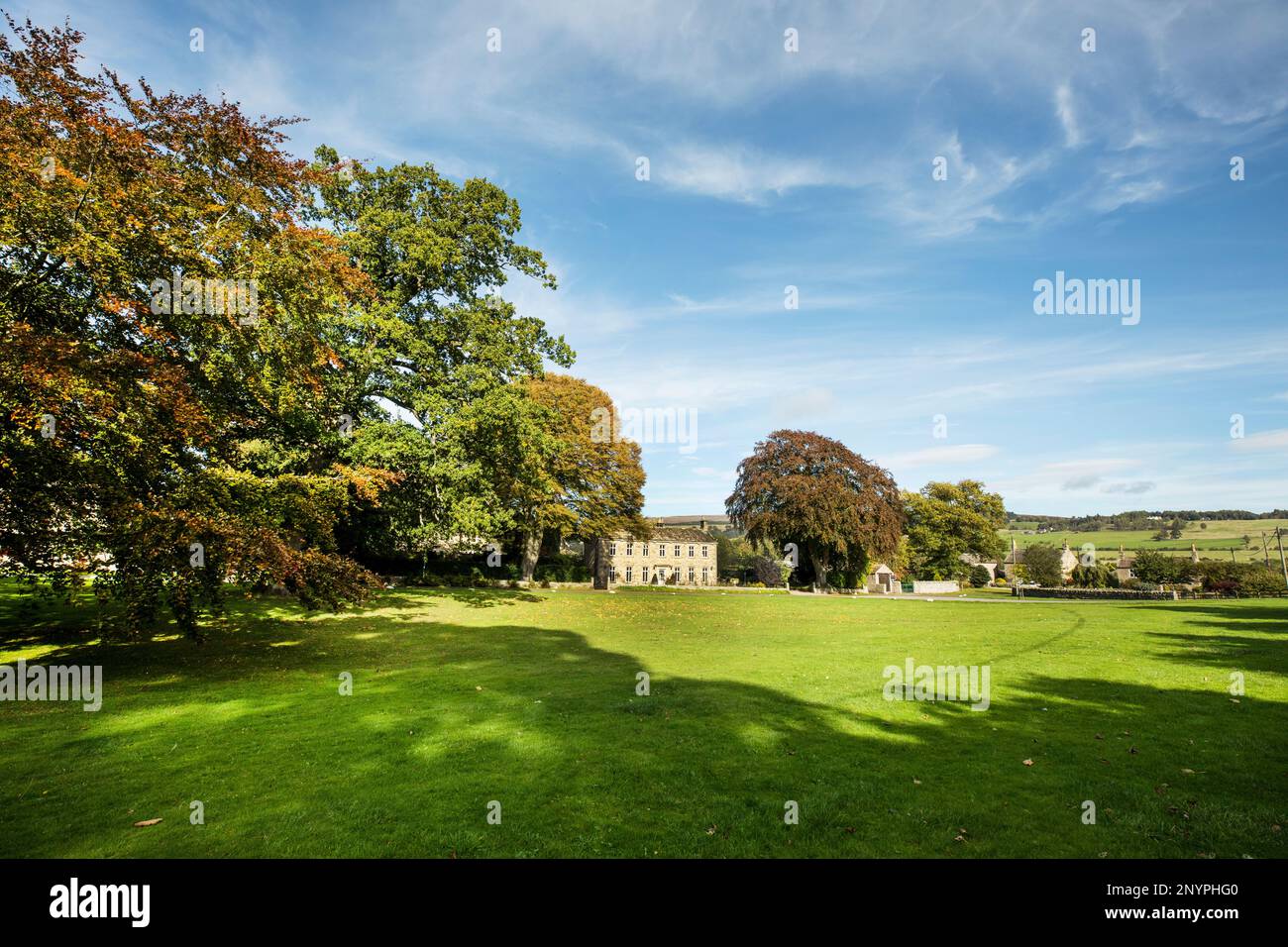 The village green of Romaldkirk Village on a sunny autumn day with a ...