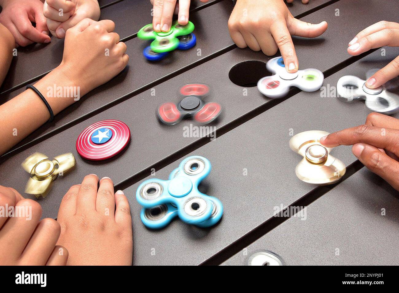 Fidget spinners, a spinning toy, emerged this spring as a must-have ...