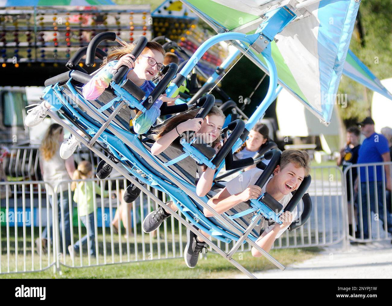 From left, Emma Romine, Rileigh Kartchner and Justin Delk ride the Hang ...