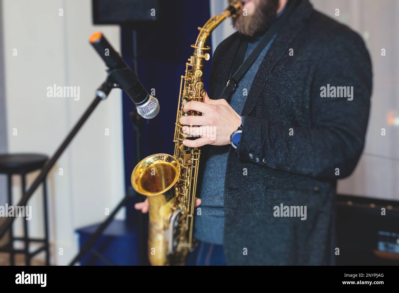 Concert view of saxophonist on a stage, a saxophone sax player with ...