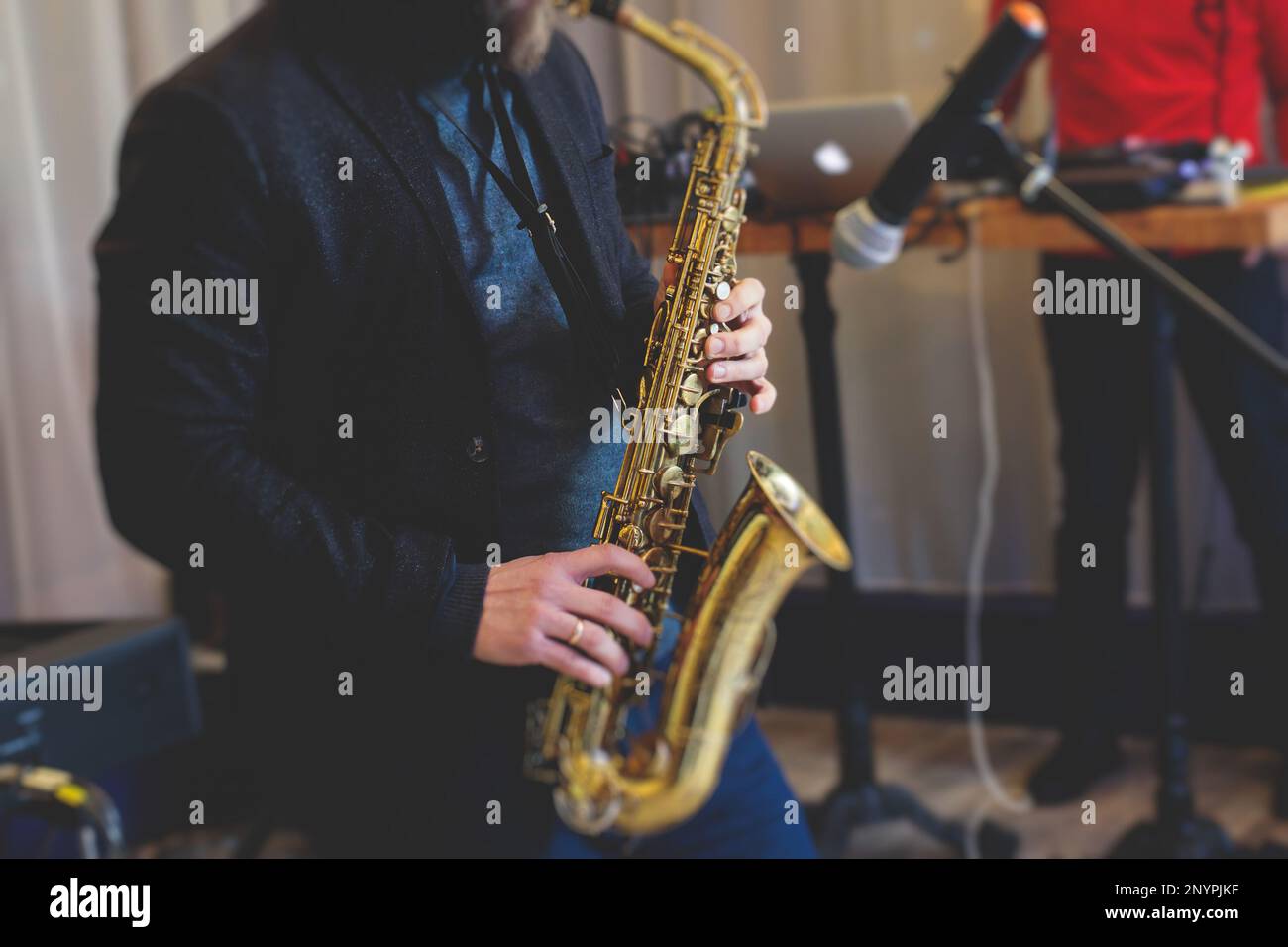 Concert view of saxophonist on a stage, a saxophone sax player with ...