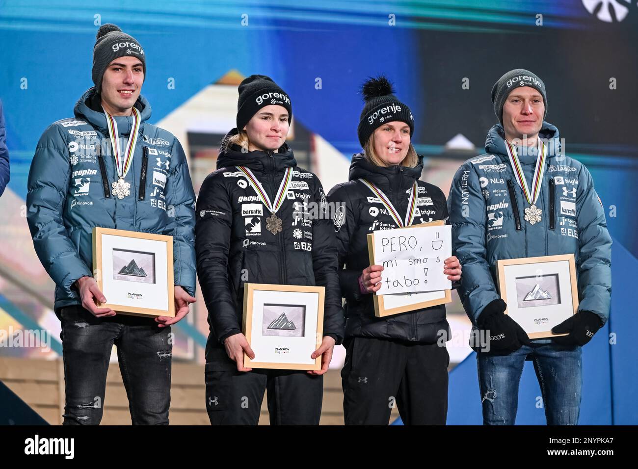 The team of Slovenia pose with their bronze medals for the Ski Jumping ...
