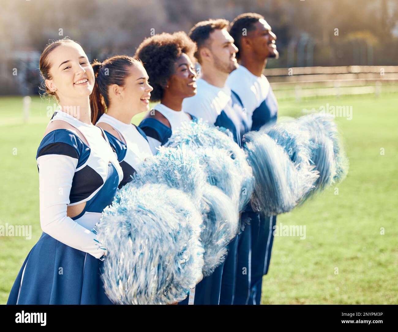 Happy, sports and portrait of a cheerleader with a team for support ...
