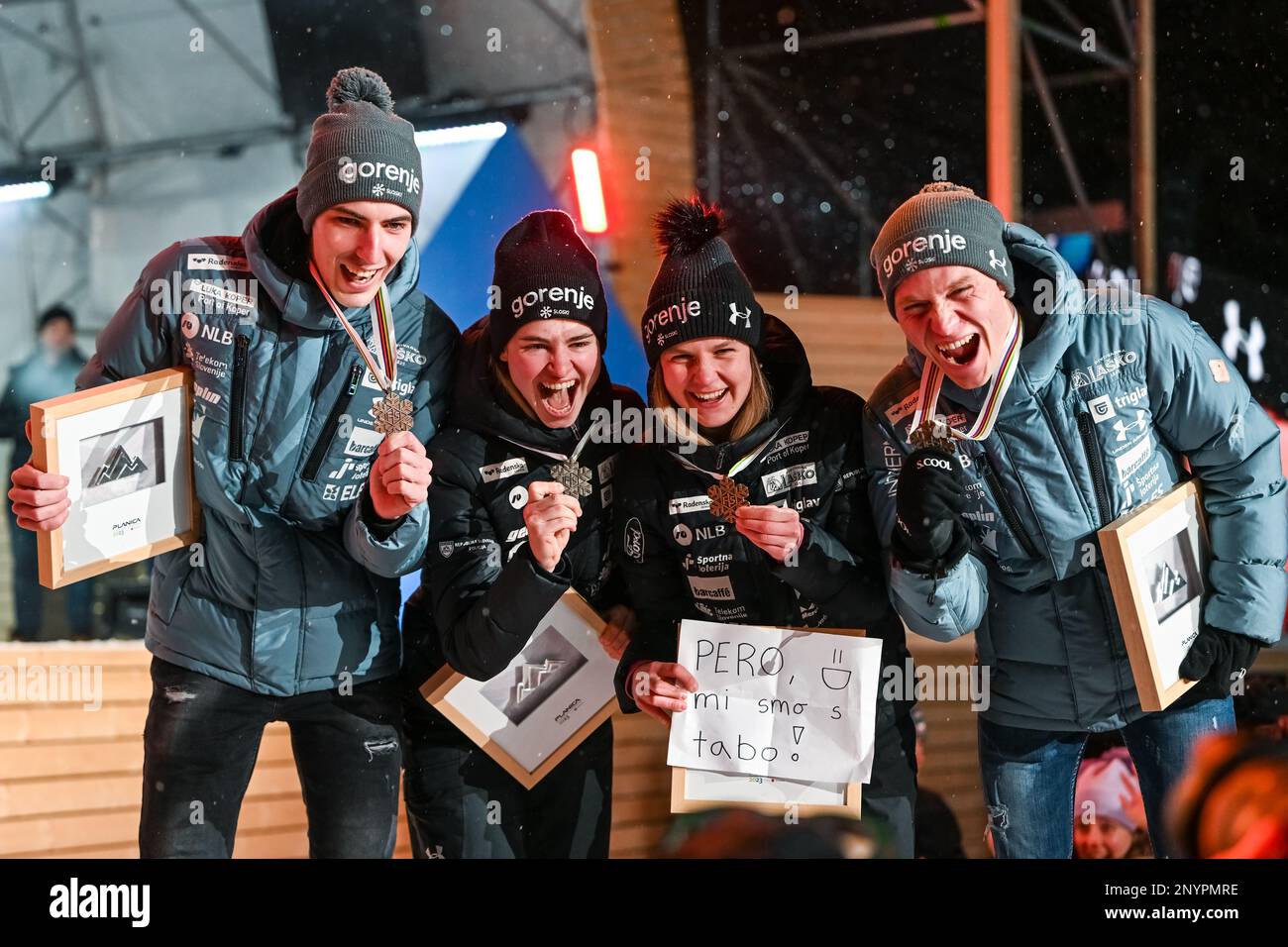 The team of Slovenia pose with their bronze medals for the Ski Jumping ...