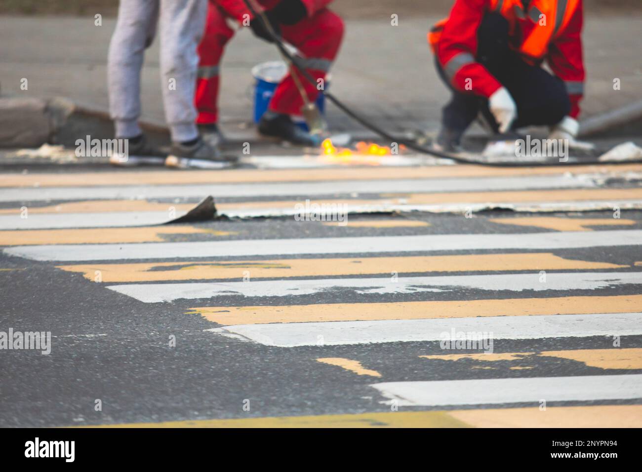 Process of making new road surface markings with a line striping ...