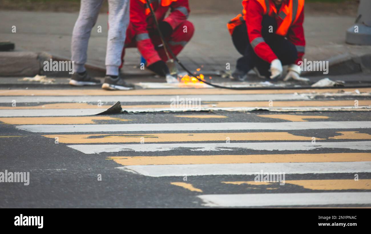 Process of making new road surface markings with a line striping ...