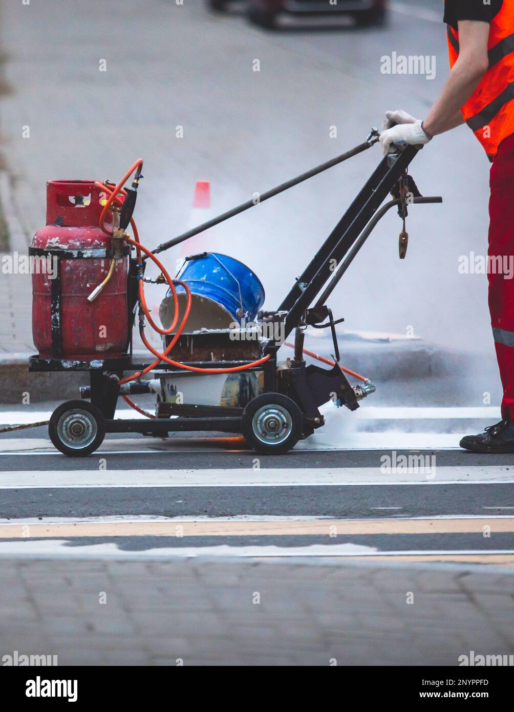 Process of making new road surface markings with a line striping ...