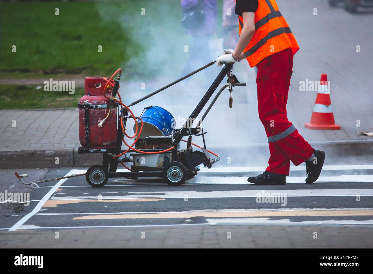 Process of making new road surface markings with a line striping ...
