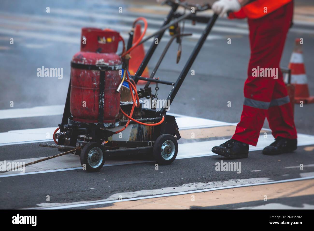Process of making new road surface markings with a line striping ...
