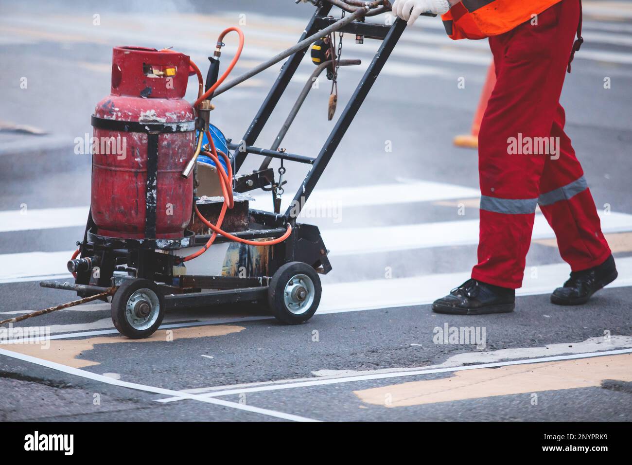 Process of making new road surface markings with a line striping ...