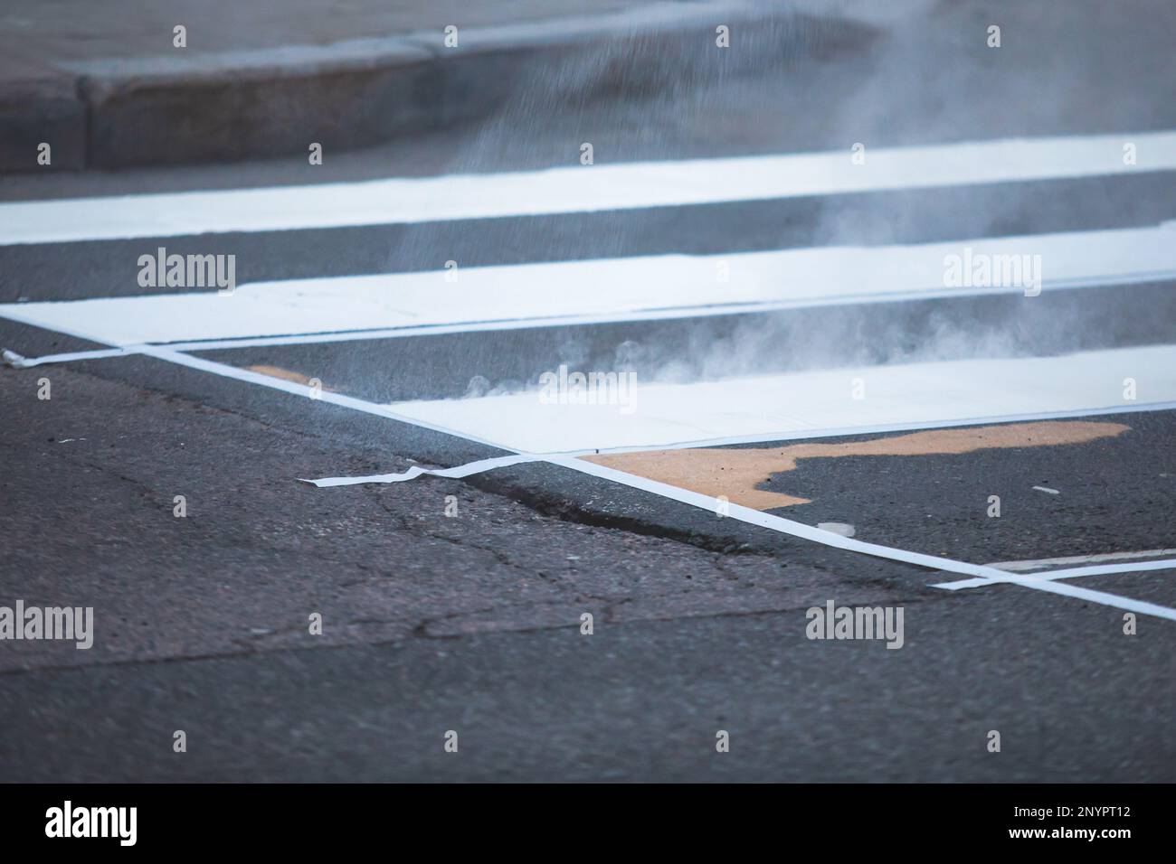 Process of making new road surface markings with a line striping ...