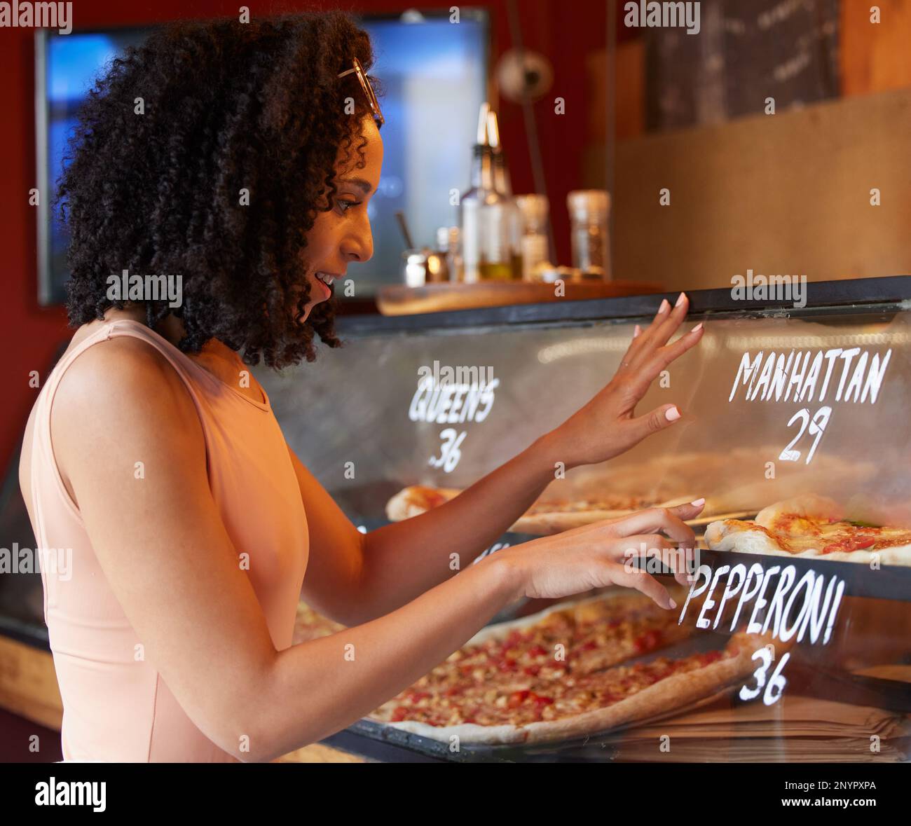 Choice, hungry and woman buying pizza for lunch with a decision ...