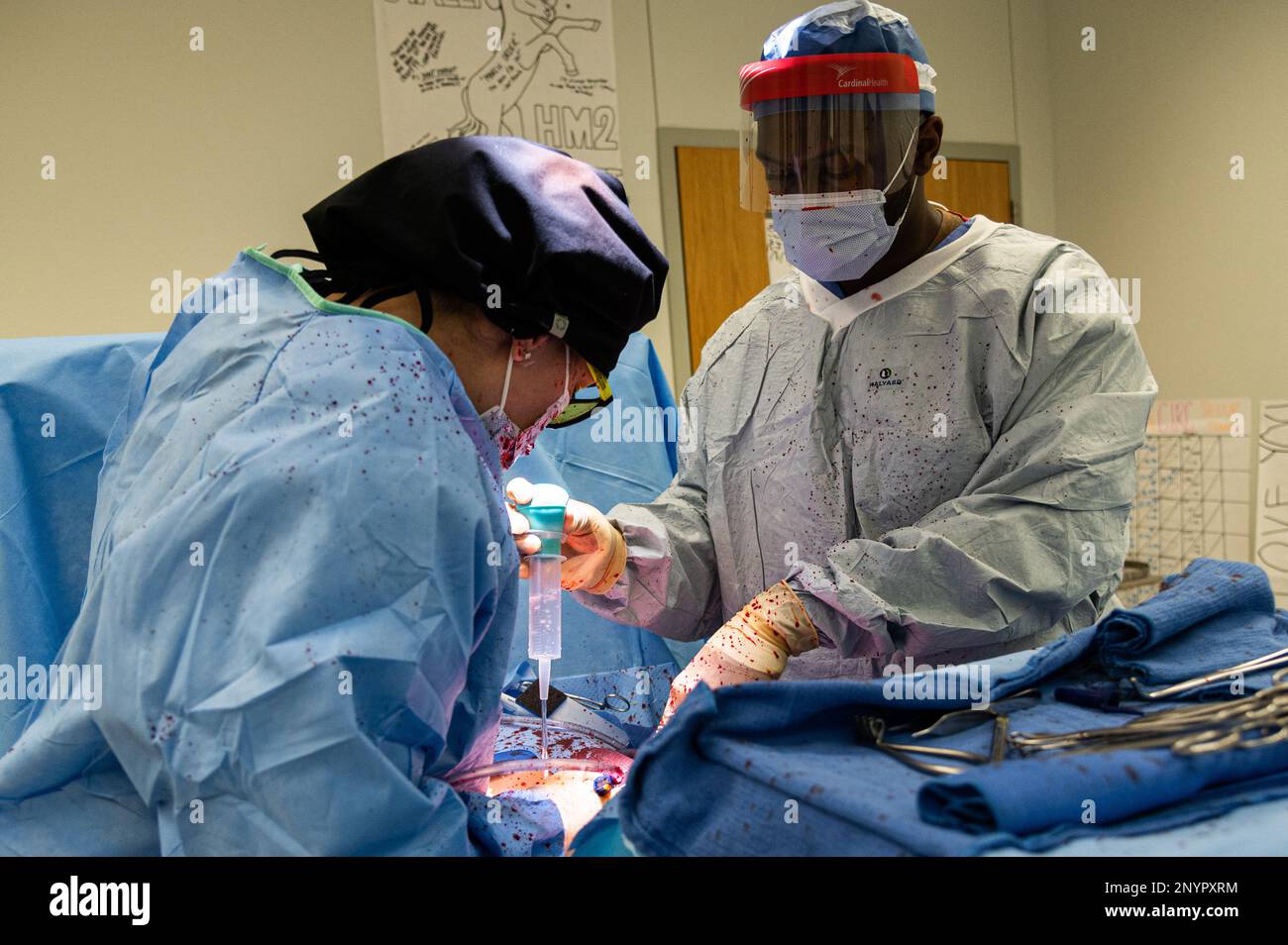 Instructors act as surgeons during a mock surgery while 68D operating ...
