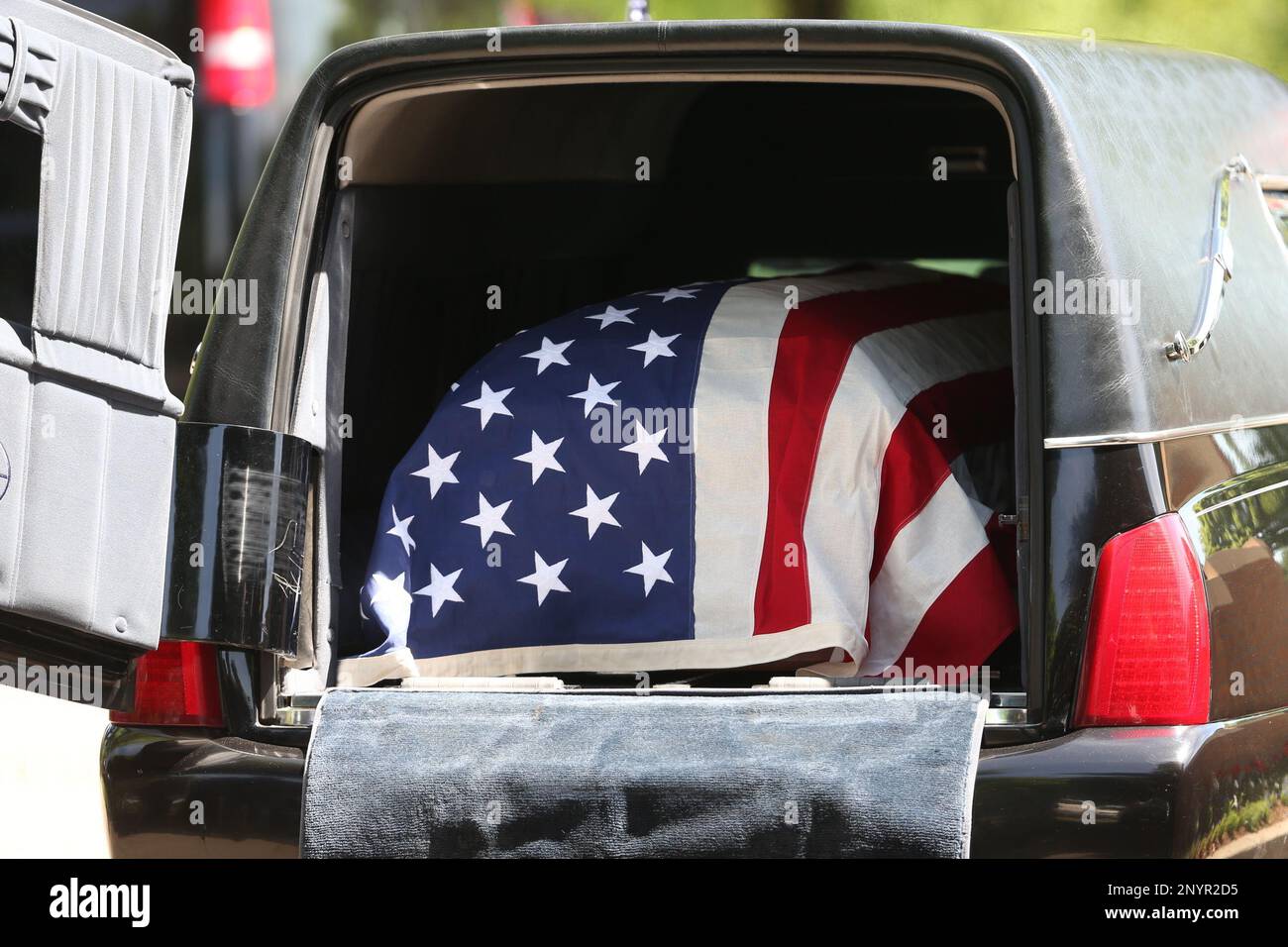 The casket of Ricky Best rests in a hearse at a burial service with ...