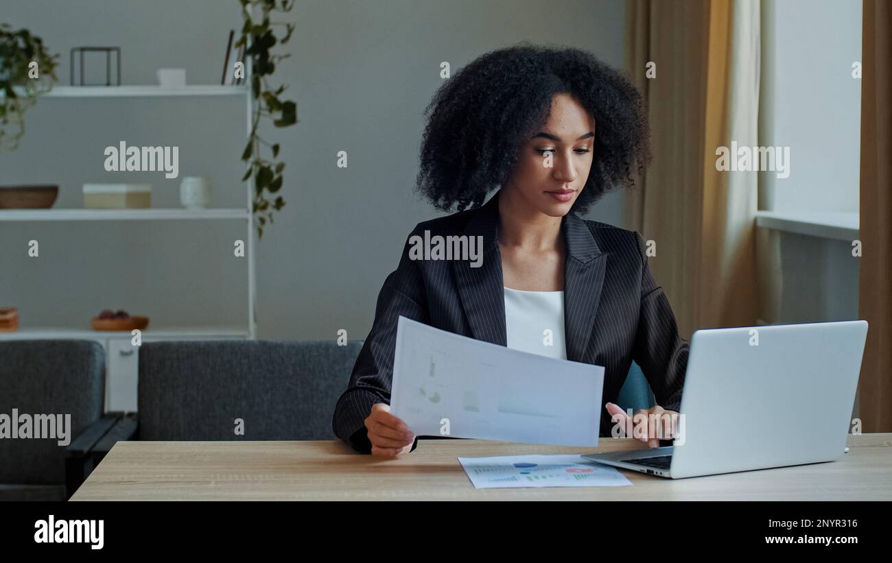 African teacher worker business woman work with graphics documents at ...