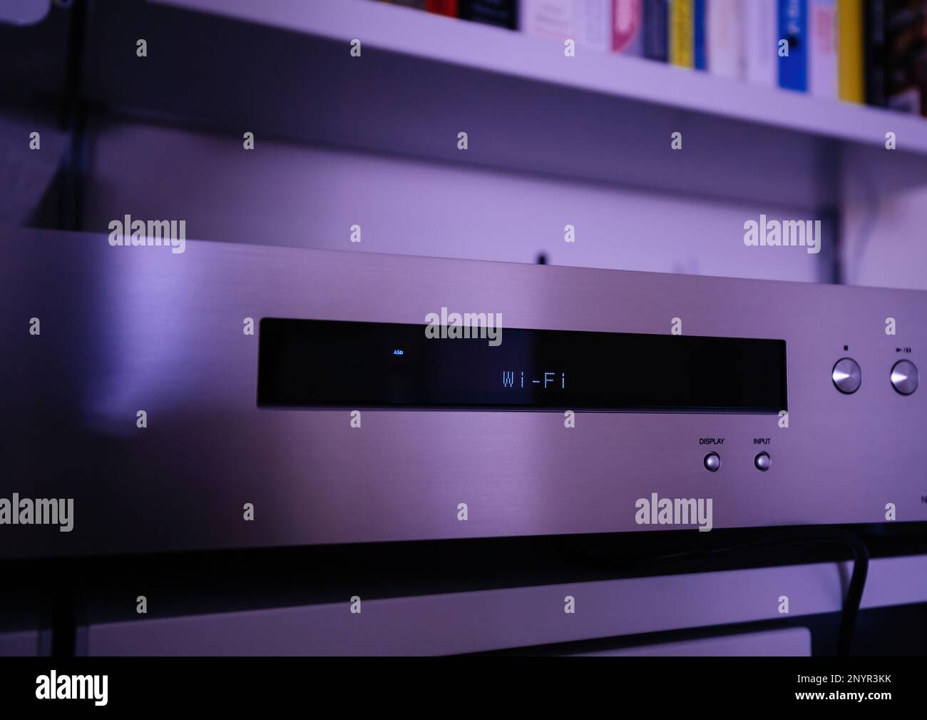 Wi-fi text on the network audio player on living room shelves Stock ...