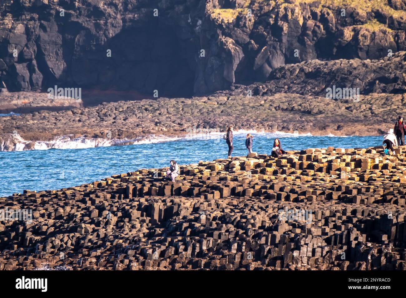 GIANT'S CAUSEWAY, NORTHERN IRELAND, UK - NOVEMBER 05 2022 : People enjoying the 40000 ...