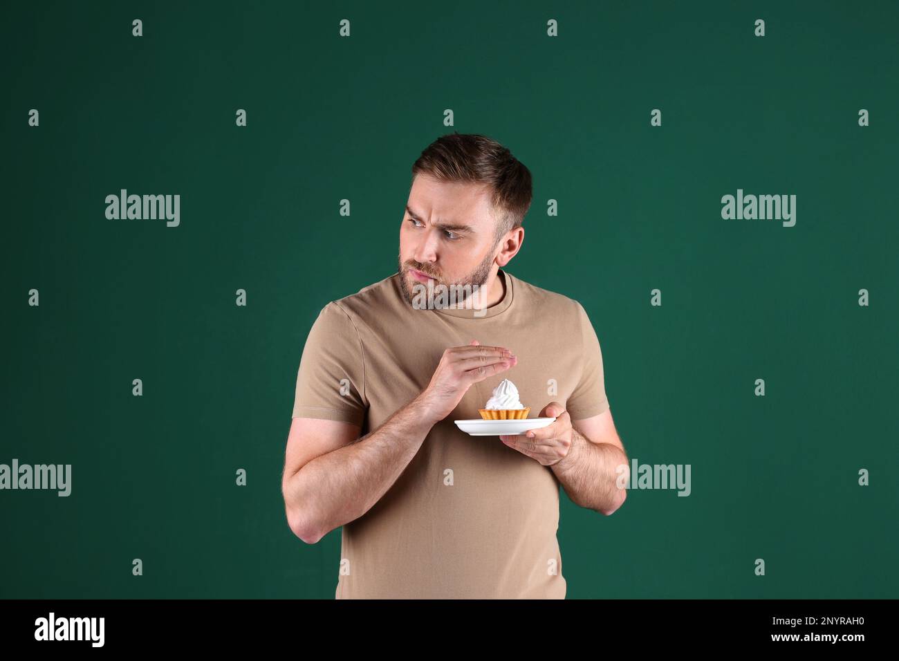 Greed on face young man hi-res stock photography and images - Alamy