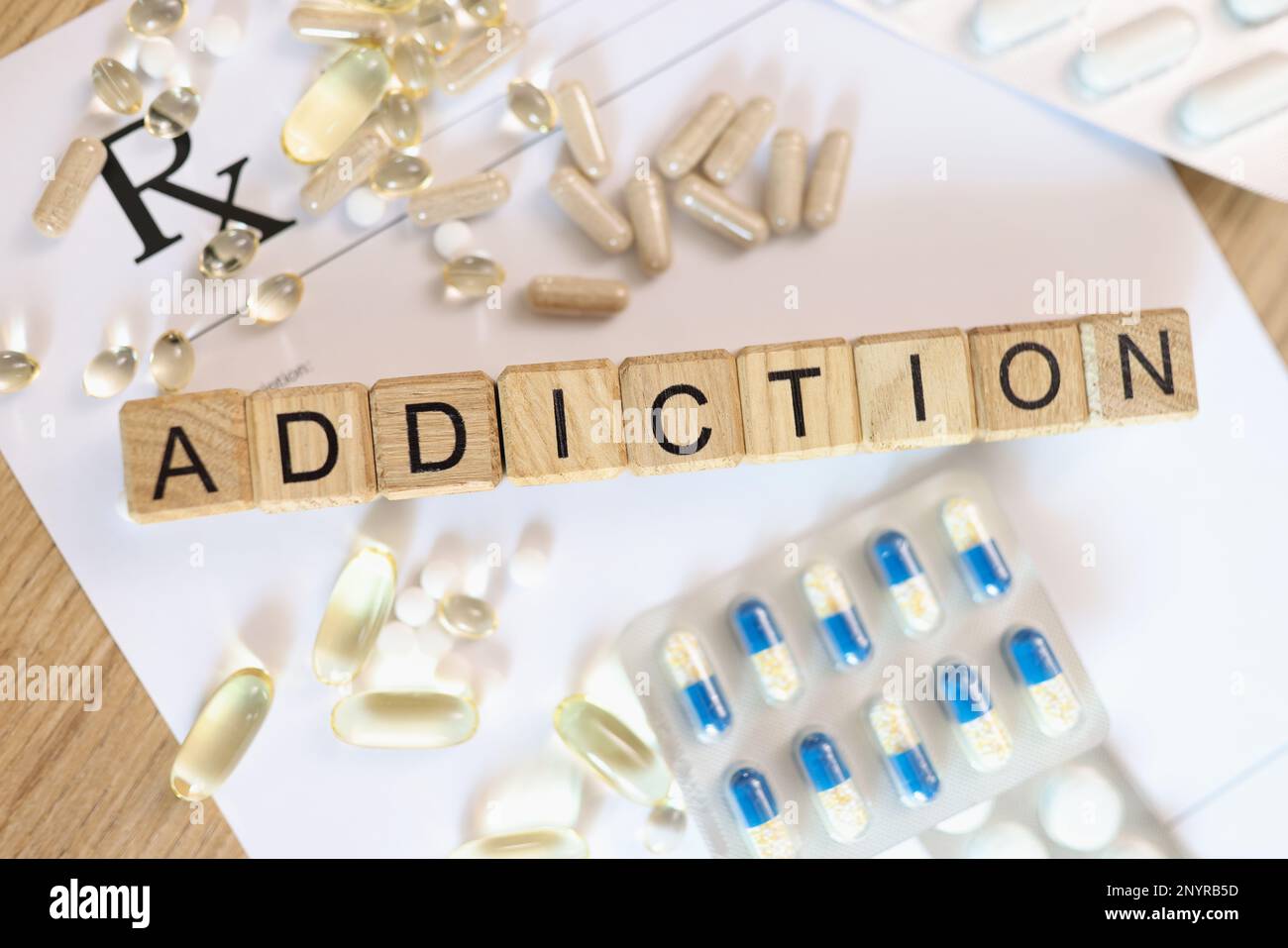 Addiction word collected with wooden cubes and medicines Stock Photo ...