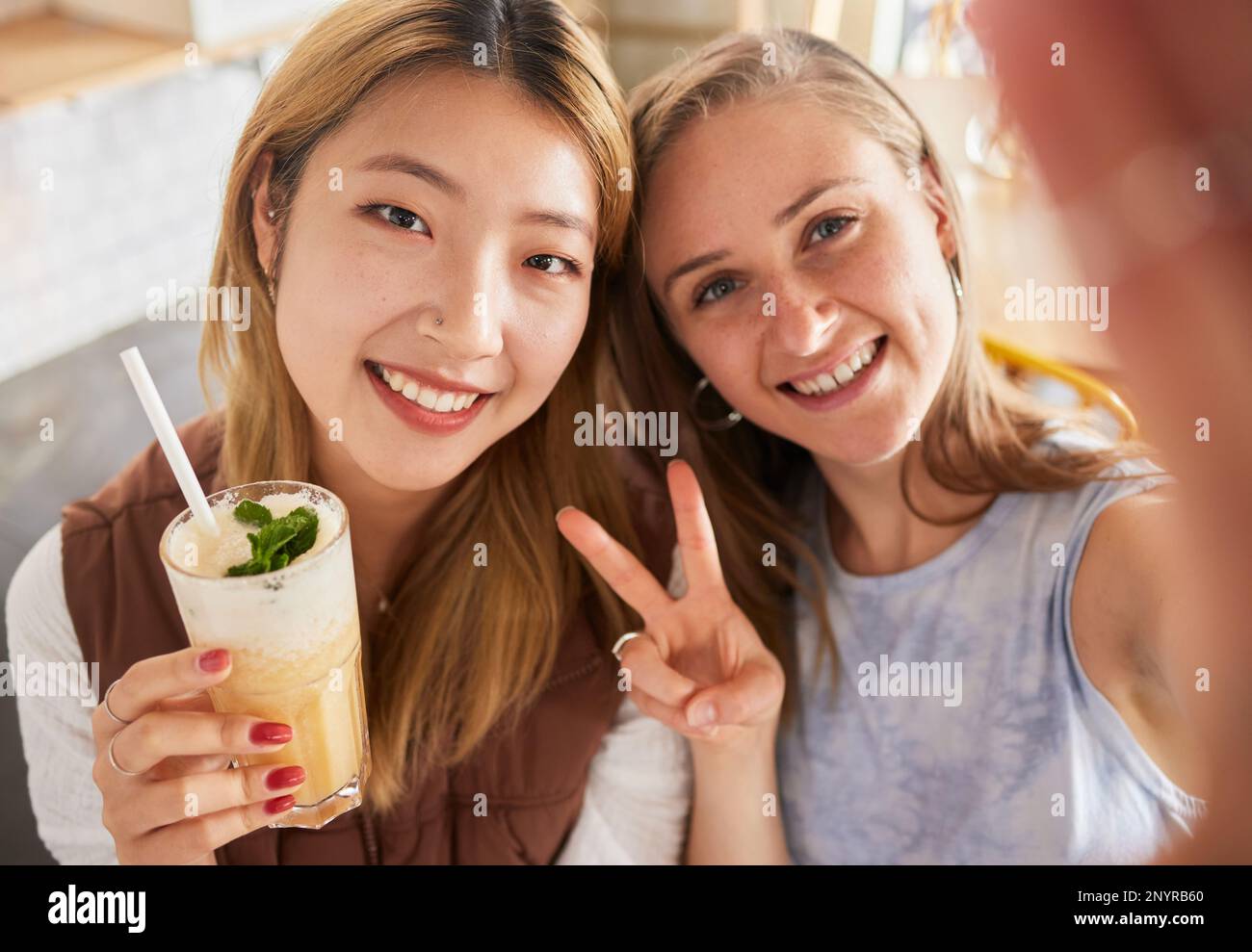 Selfie, portrait or friends take profile picture in cafe with happy smile on holiday vacation or ...