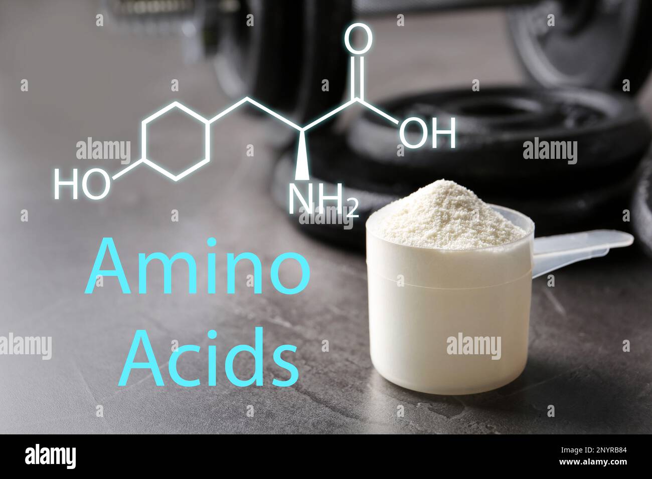 Measuring scoop of amino acids powder on grey table Stock Photo - Alamy