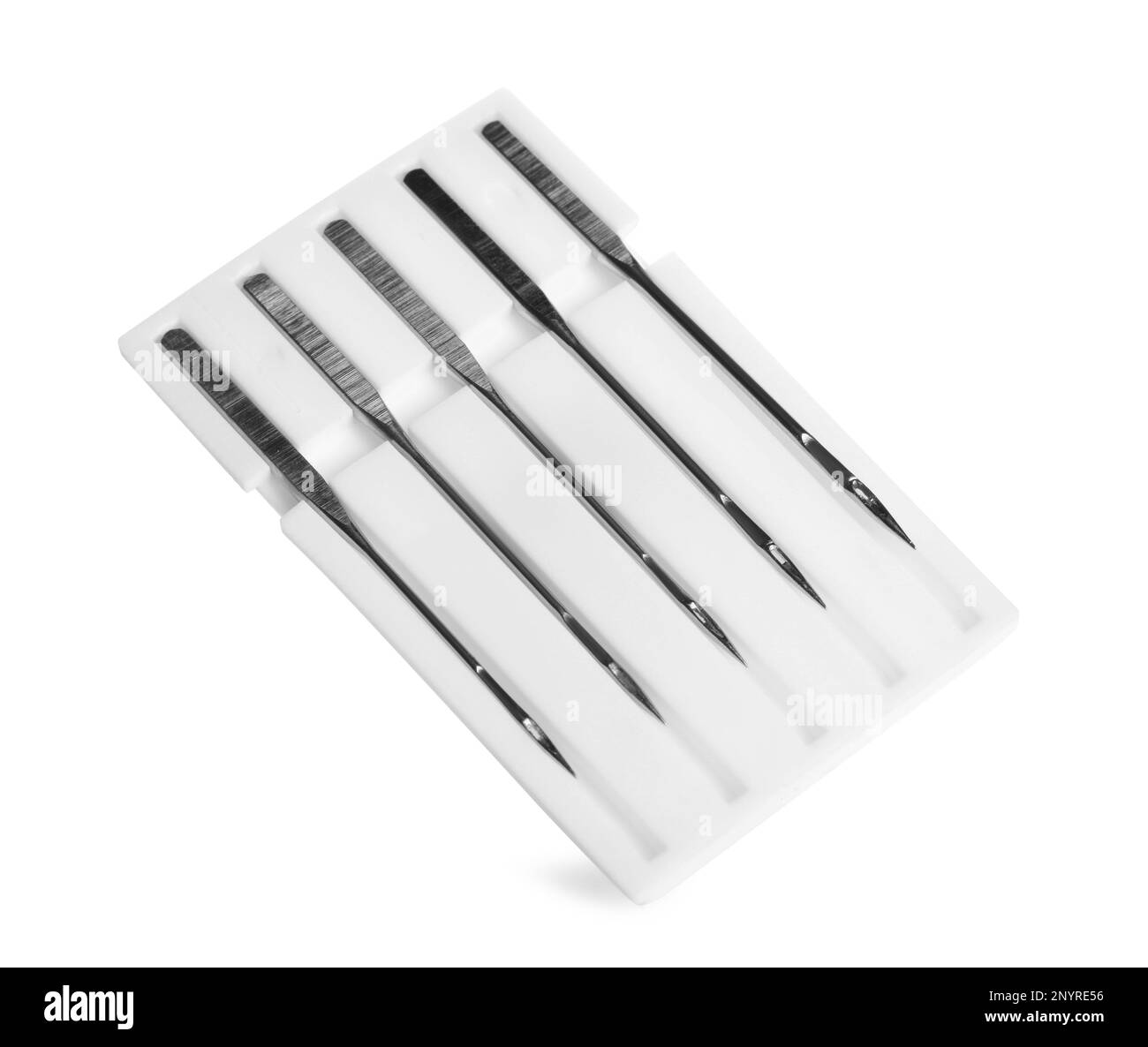 Set of metal needles for sewing machine on white background Stock Photo ...