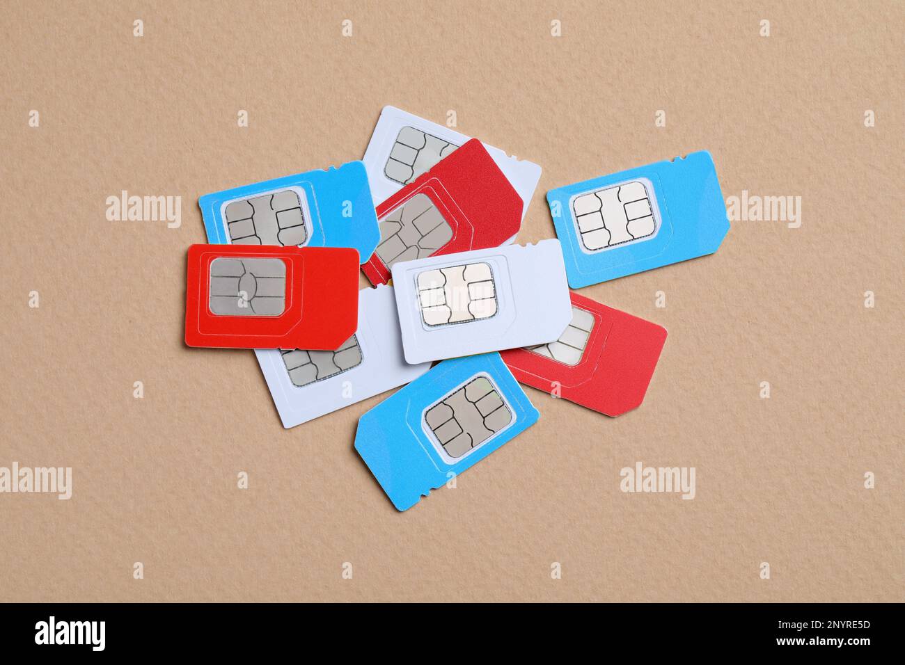 Pile of different SIM cards on beige background, flat lay Stock Photo ...