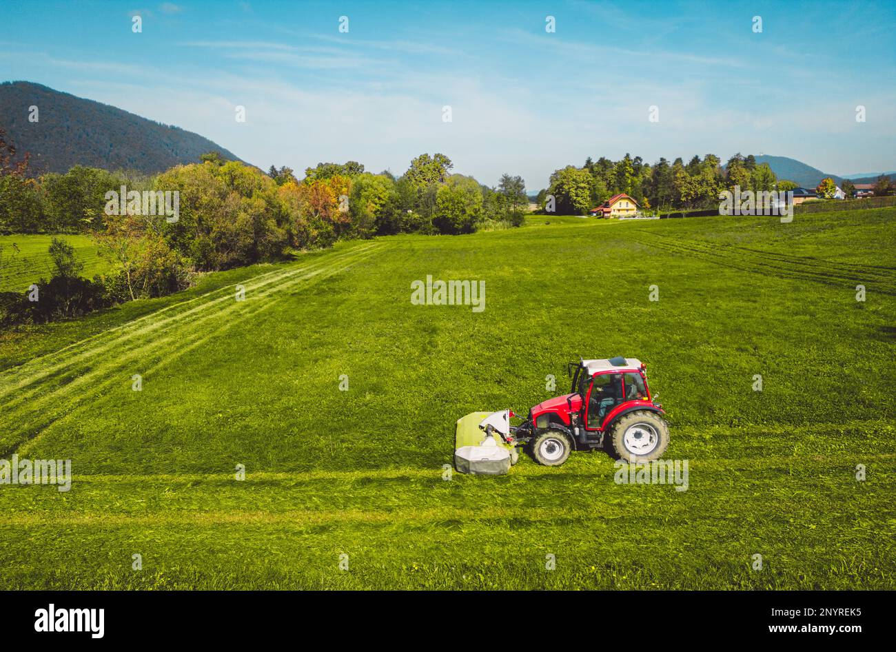 Tractor side mower cutting grass hi-res stock photography and images ...