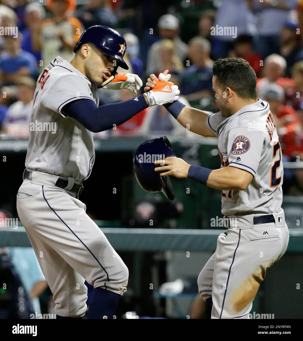 Houston Astros' Carlos Correa, left, celebrates his three run homer run ...