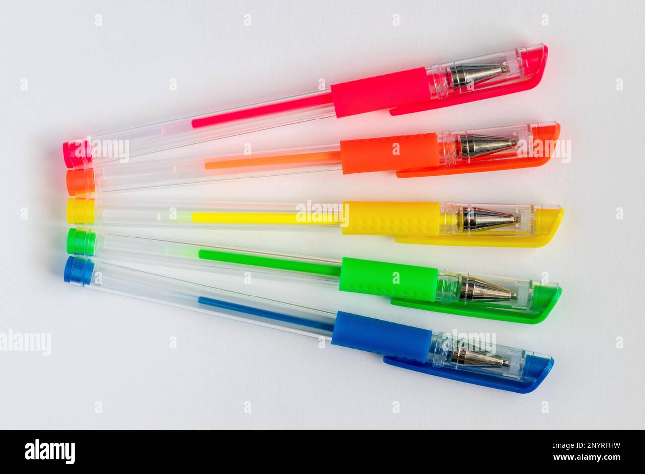 Colorful neon colors gel pens on white background Stock Photo - Alamy