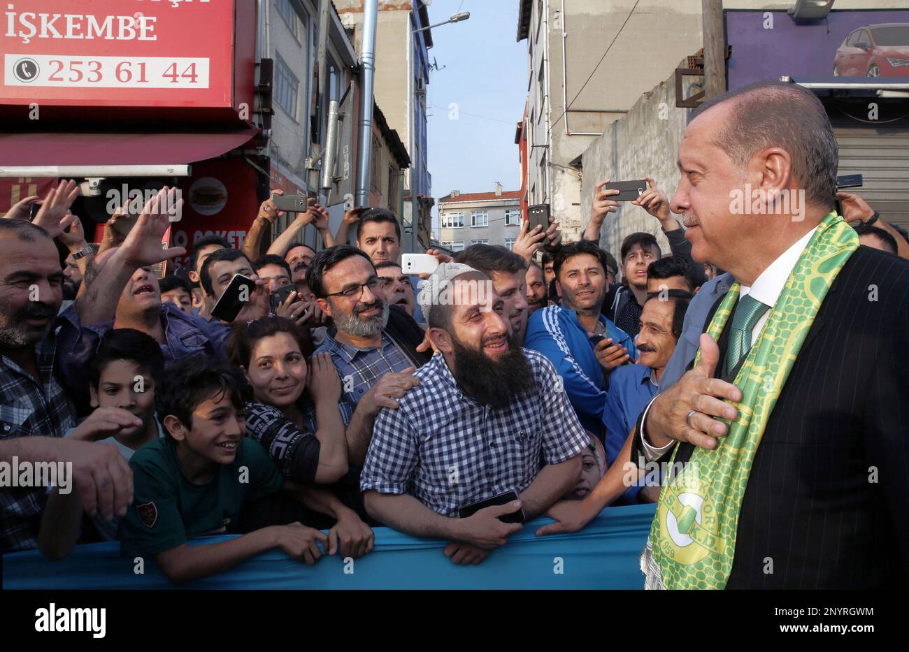 Turkey's President Recep Tayyip Erdogan greets supporters as he arrives ...