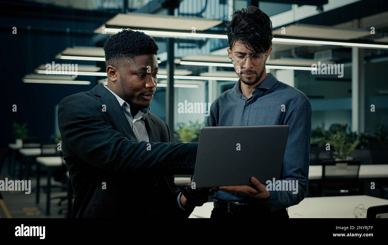 Male businessmen colleagues work with computer corporate teamwork ...