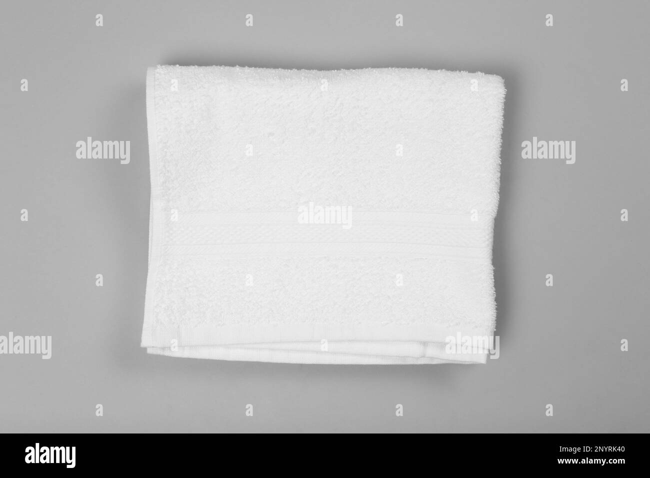 Folded white beach towel on light grey background, top view Stock Photo ...