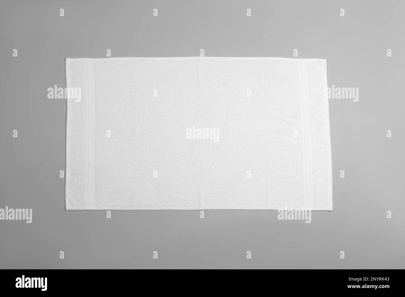 White beach towel on light grey background, top view Stock Photo - Alamy