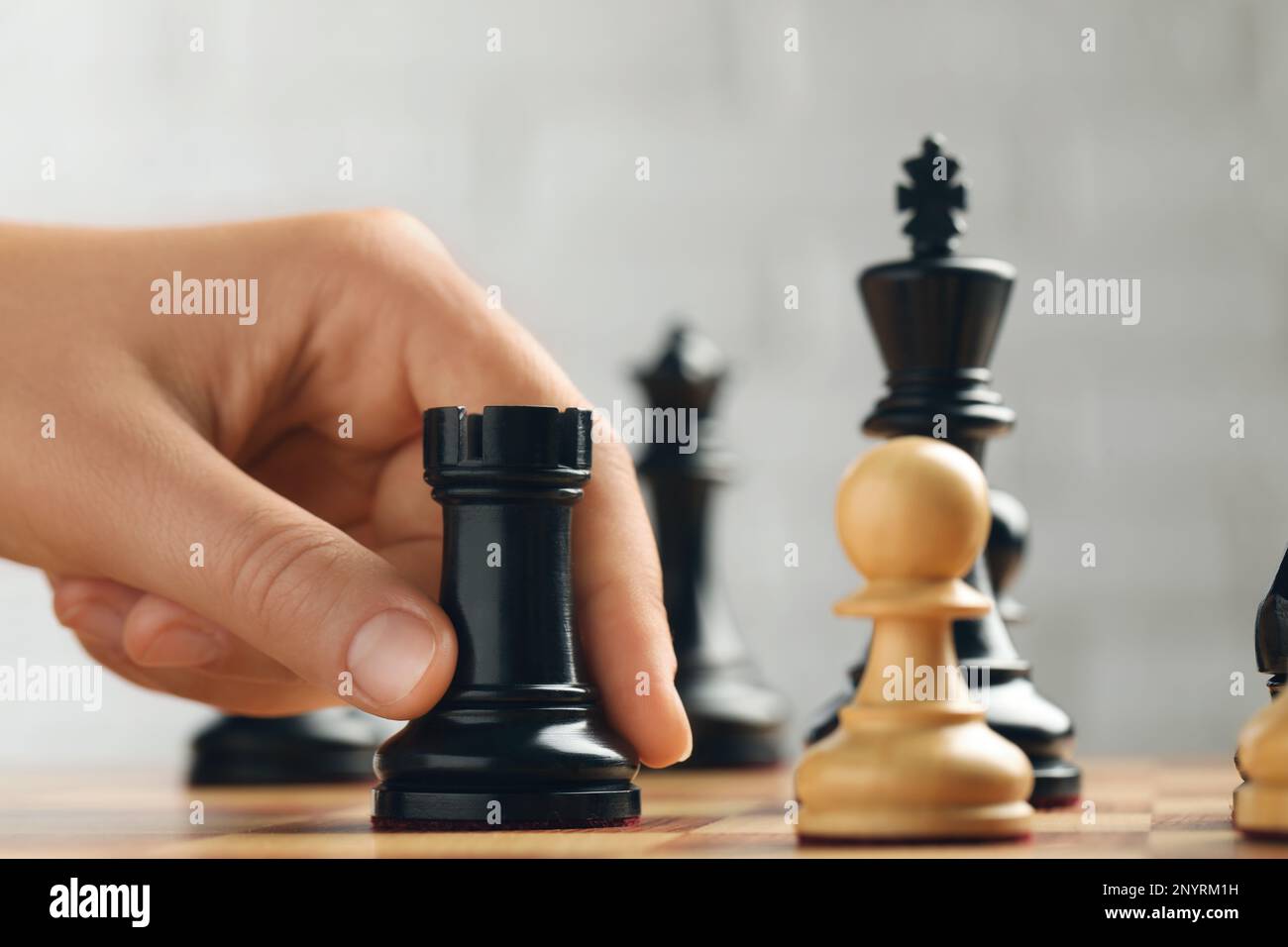 Woman moving chess piece hi-res stock photography and images - Alamy
