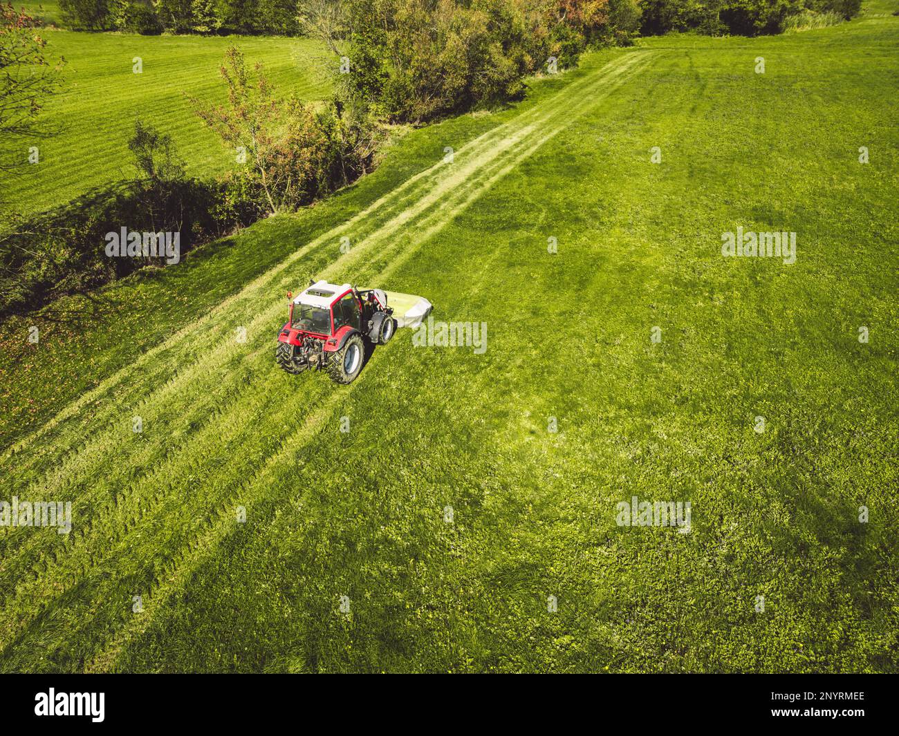 Tractor side mower cutting grass hi-res stock photography and images ...