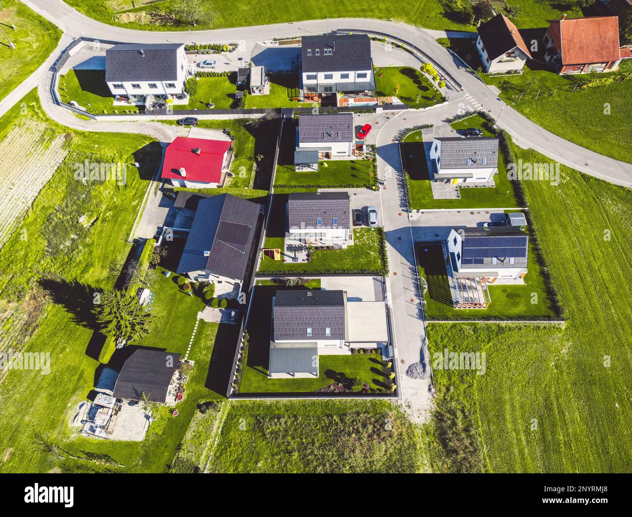 Arial view of newly developed housing community surrounded by green ...